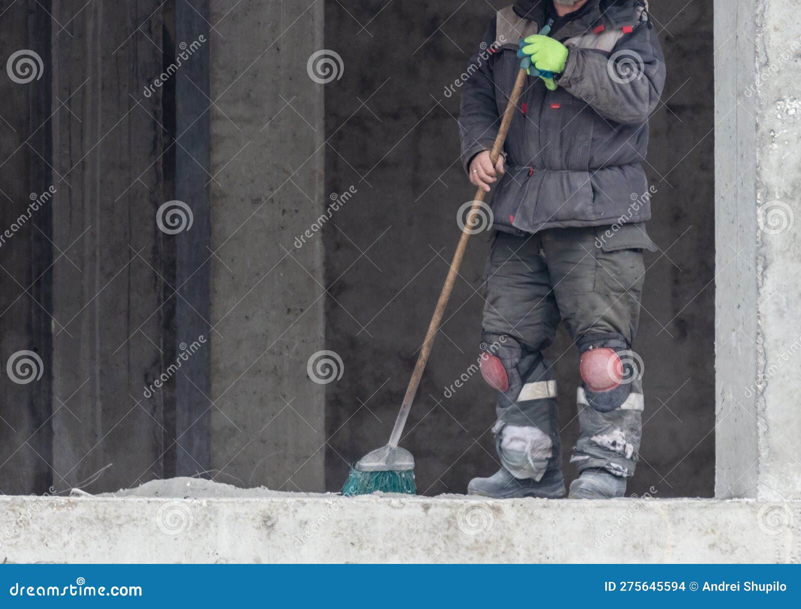 The Worker Sweeps the Garbage at the Construction Site of the House ...