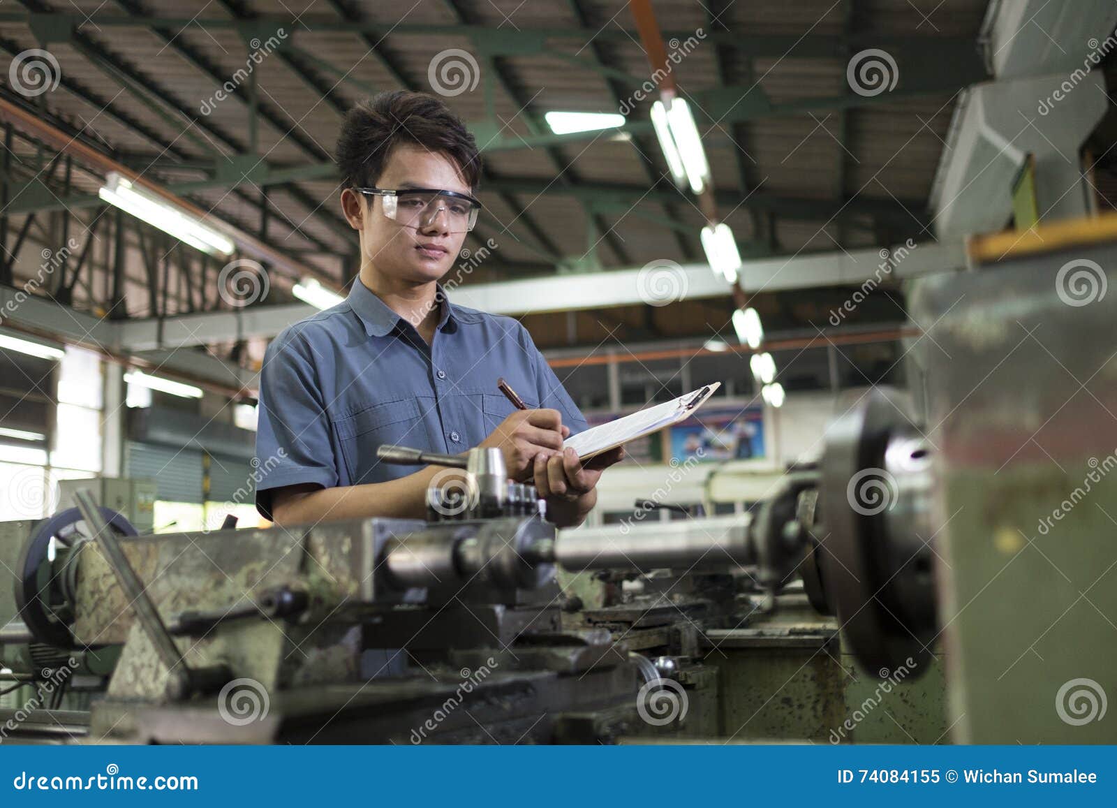 Worker Take Note for Check Machine. Stock Image - Image of note ...