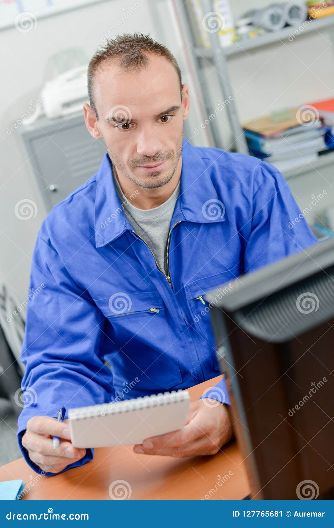 Worker Taking Down Notes from Computer Screen Stock Image - Image of ...
