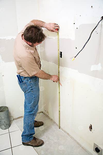 Worker Taking Measurement stock image. Image of marking - 6129269