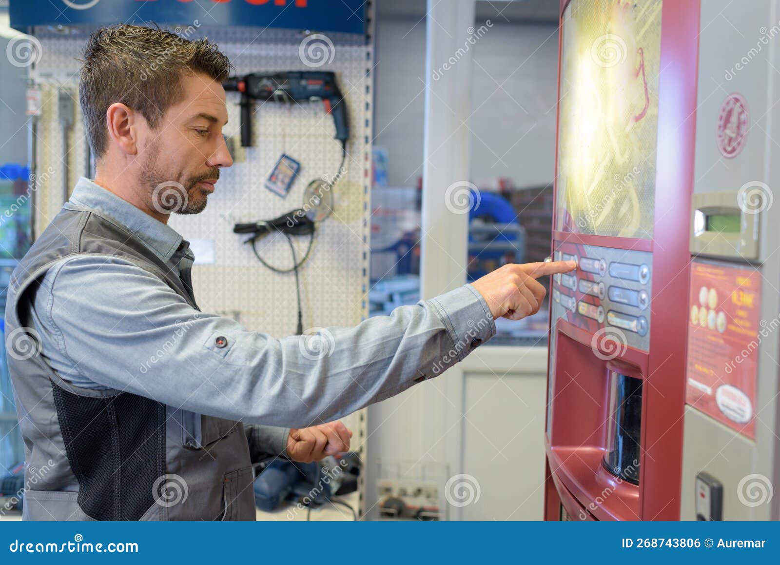 Worker Taking Out Drink from Vending Machine Stock Photo - Image of ...