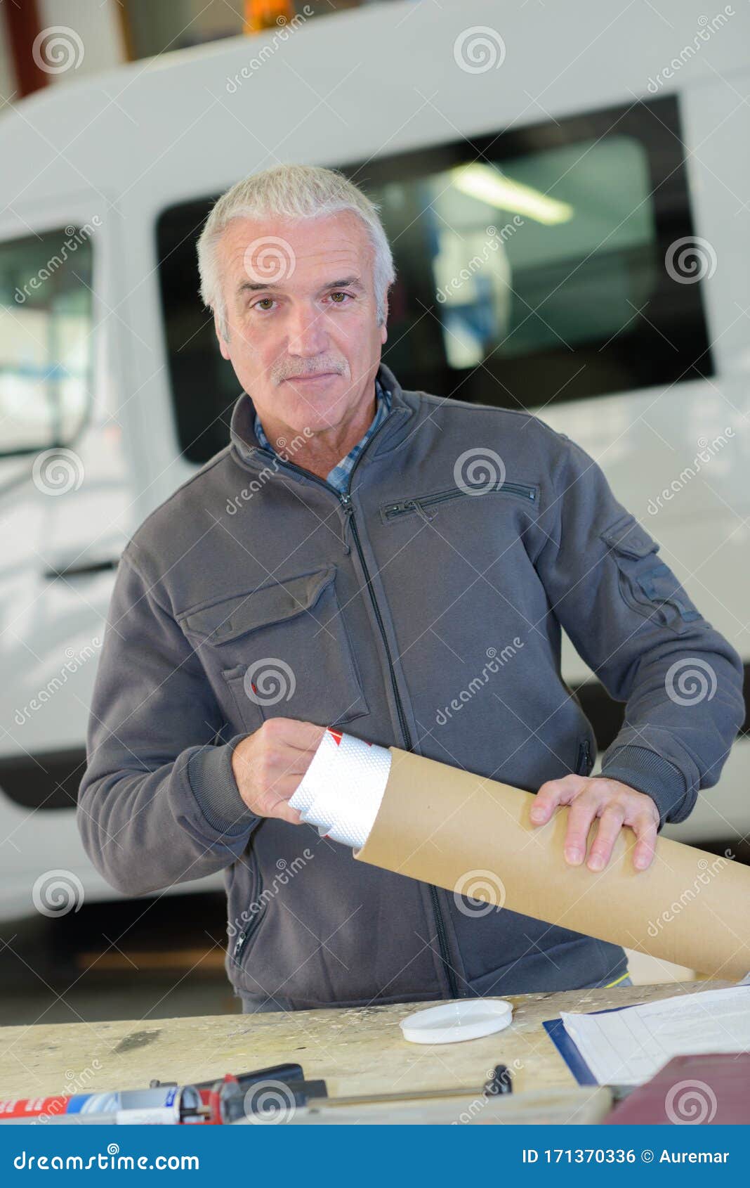 Worker Taking Paper from Cardboard Roll Stock Photo - Image of delivery ...