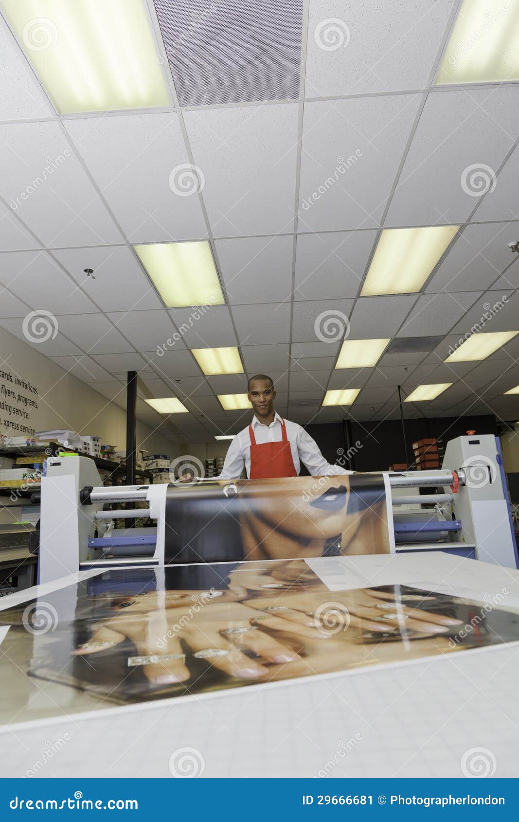 Worker Taking Printouts at Printing Press Stock Image - Image of ...