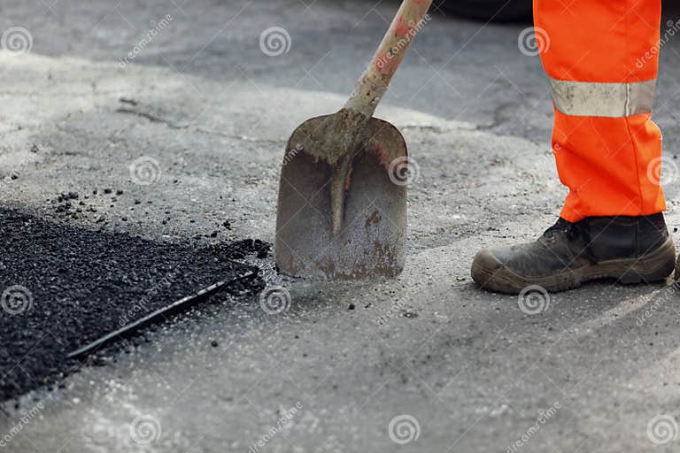 Worker tarmacking road stock image. Image of levelling - 14750153