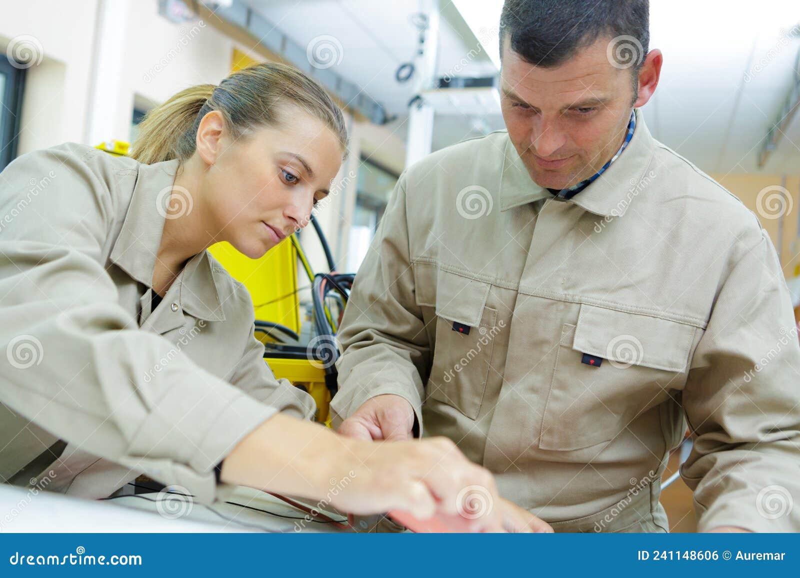 Worker Teaching Female Trainee How To Use Machine Stock Photo - Image ...