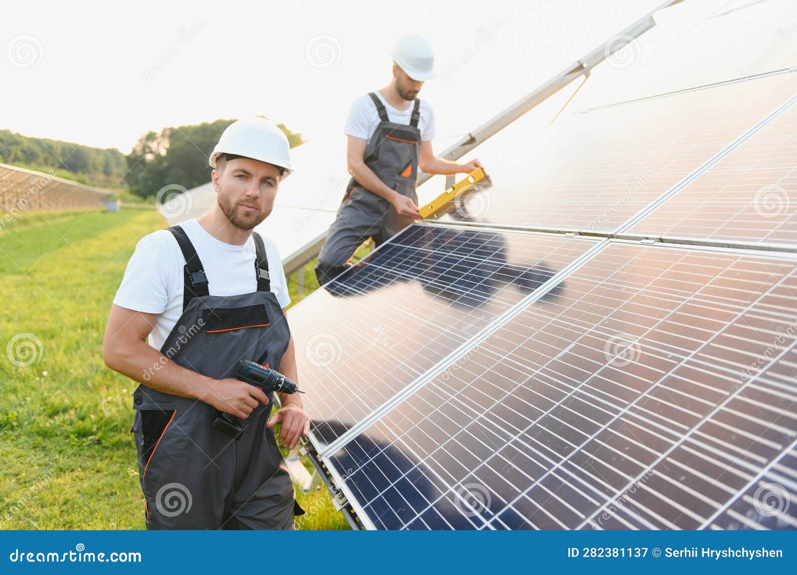 Worker Team with Solar Panel. Worker Team Has Success Install Solar ...