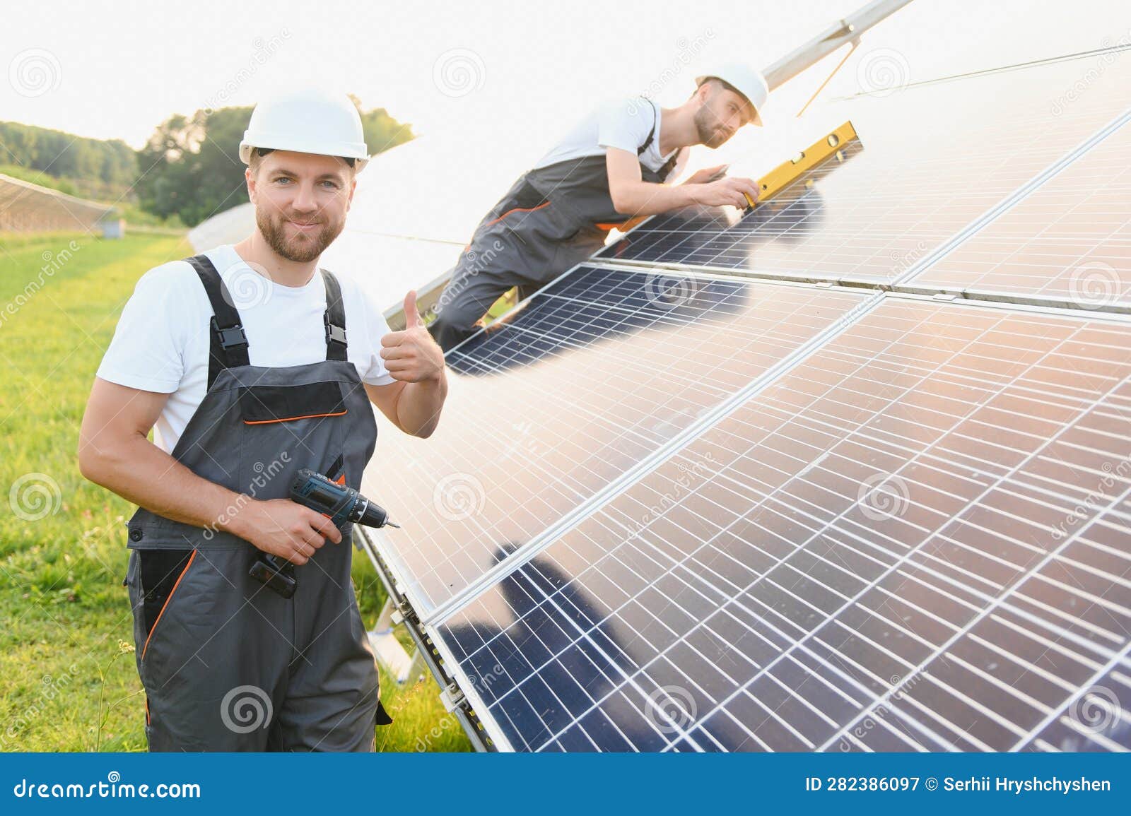 Worker Team with Solar Panel. Worker Team Has Success Install Solar ...