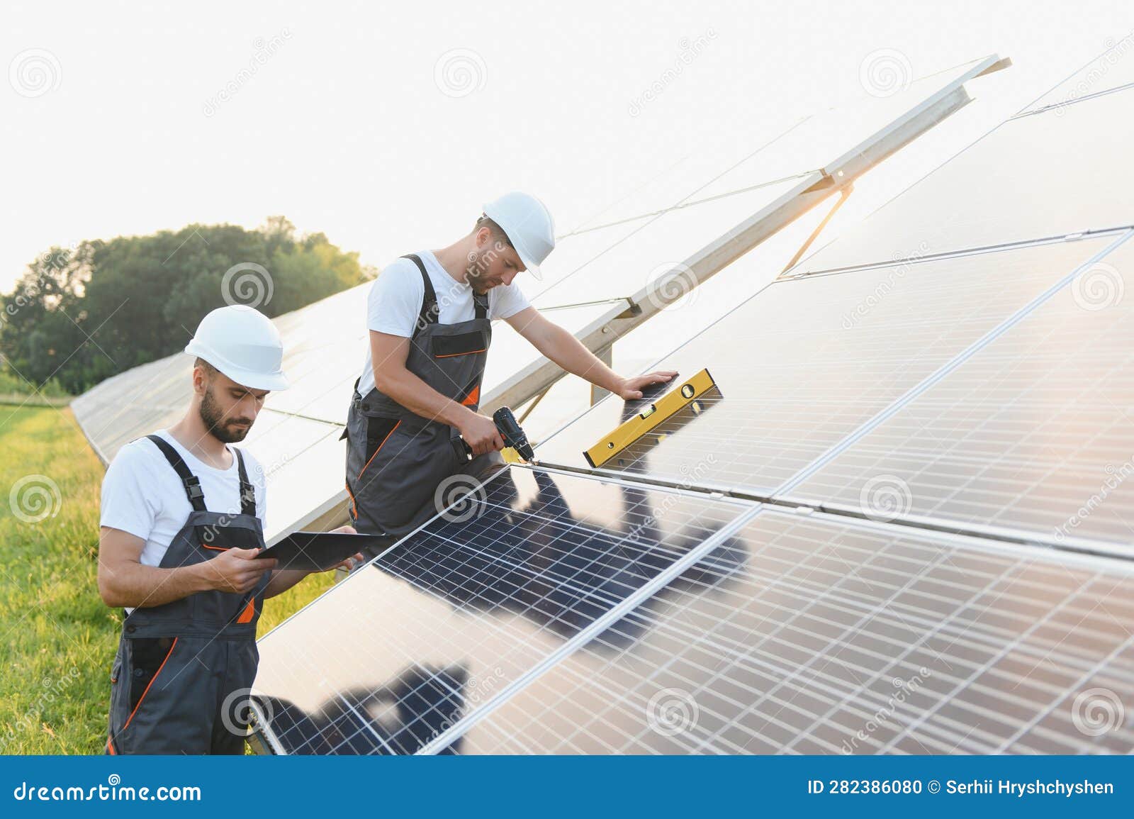 Worker Team with Solar Panel. Worker Team Has Success Install Solar ...