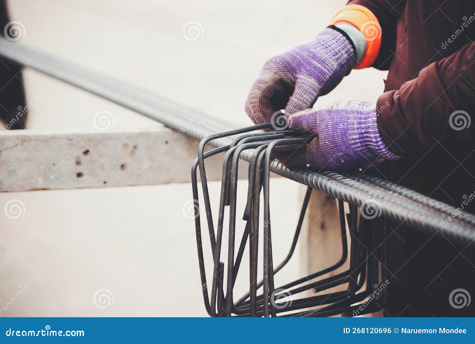 Worker Ties Wire Metal Steel To Building Structure At Construction Site Man Hand Holding