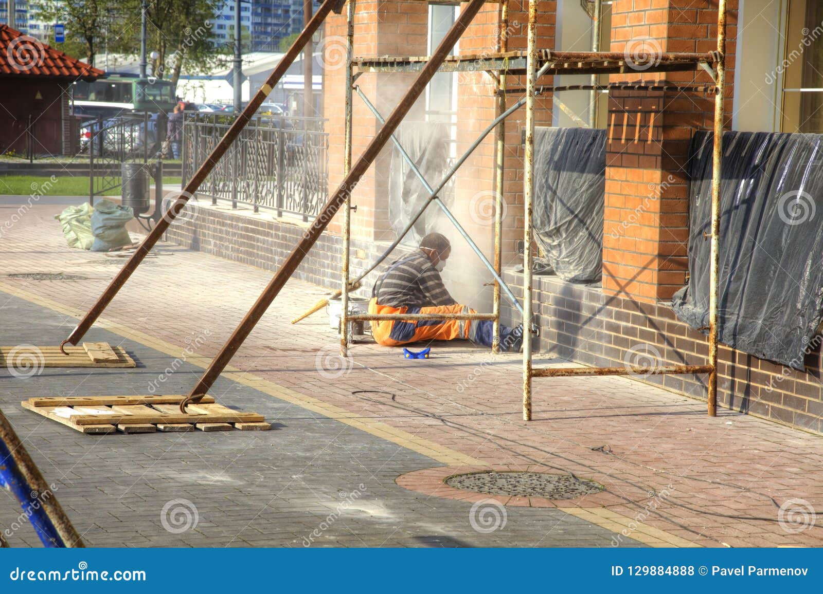 Worker laying tiles stock photo. Image of fitting, person - 129884888