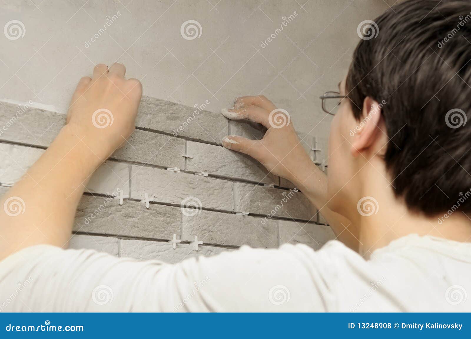 Worker Tiler Puts Ceramic Tiles Royalty-Free Stock Image ...