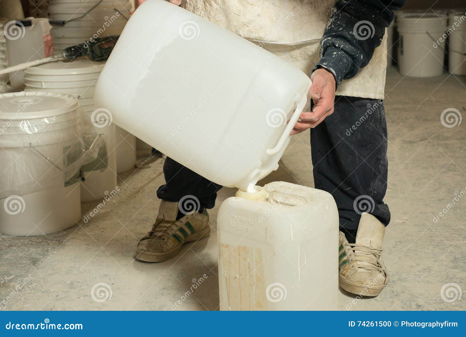 Worker Transfering Liquid Plaster Resin into Plastic Container Stock ...