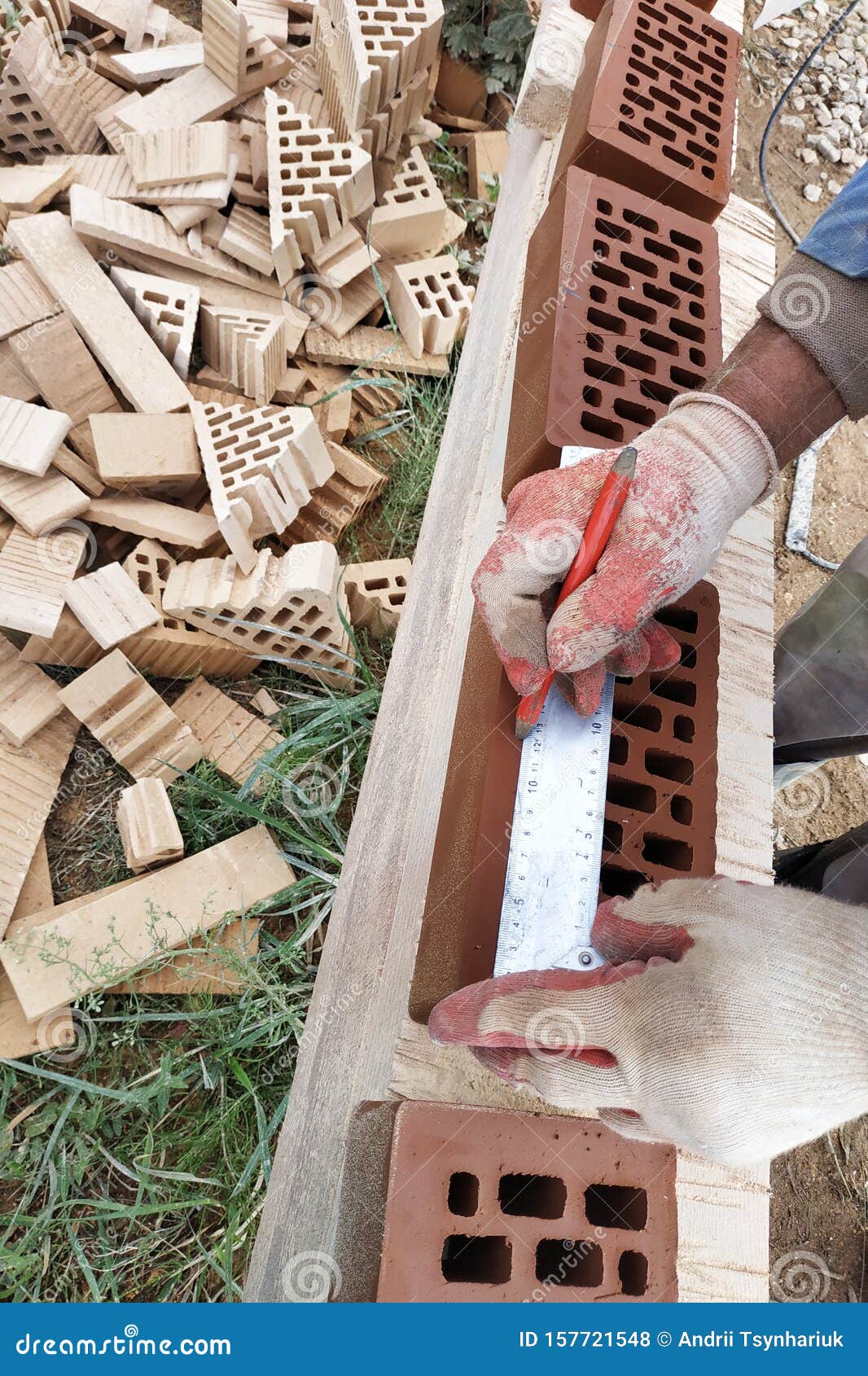The Worker Translates the Facade Bricks for Further Measurement and ...