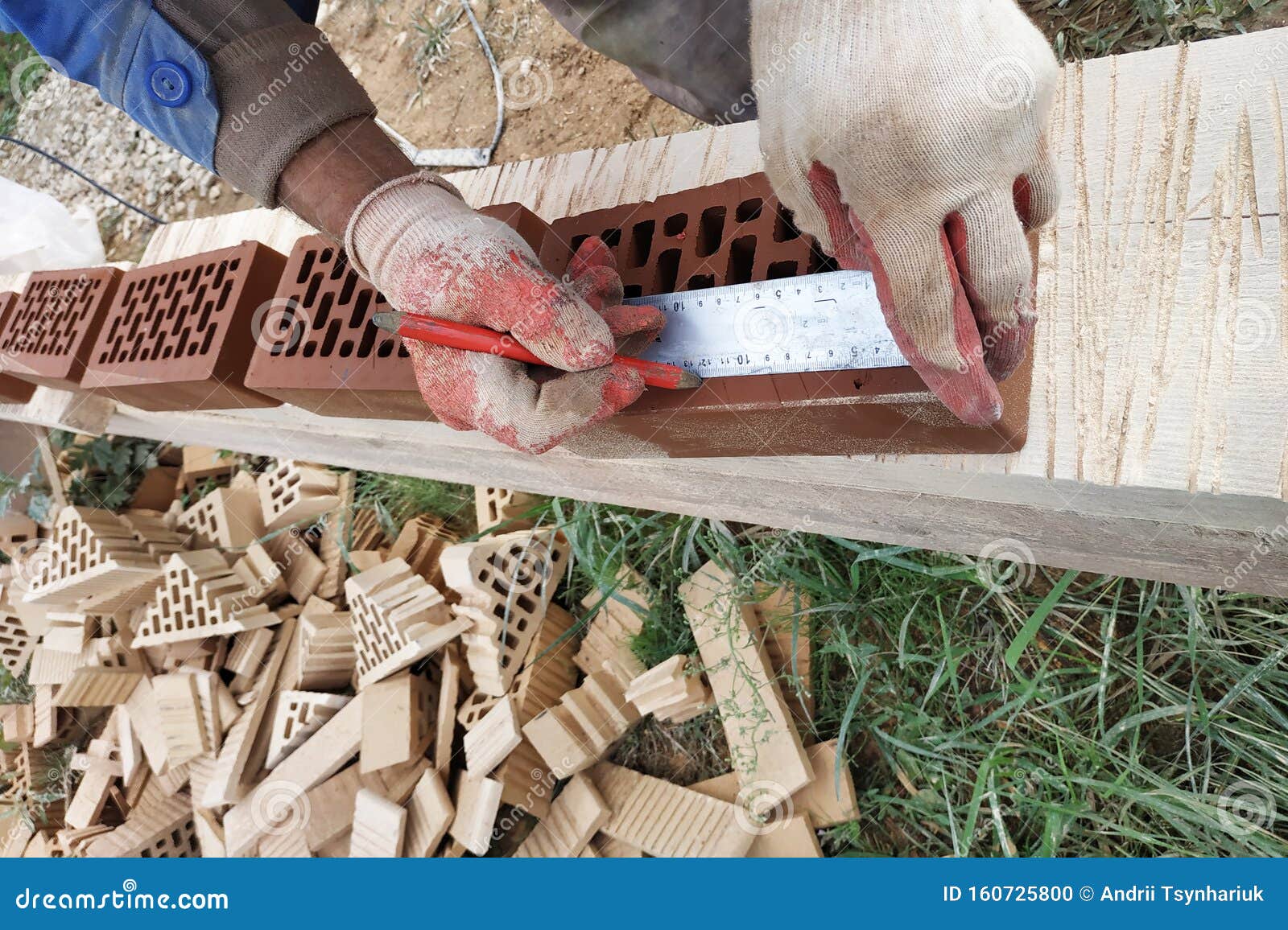 The Worker Translates the Facade Bricks for Further Measurement and ...