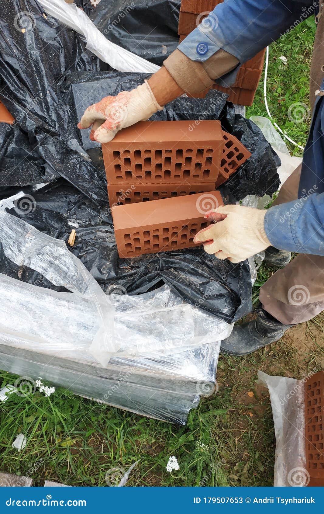 The Worker Translates the Facade Bricks for Further Measurement and ...