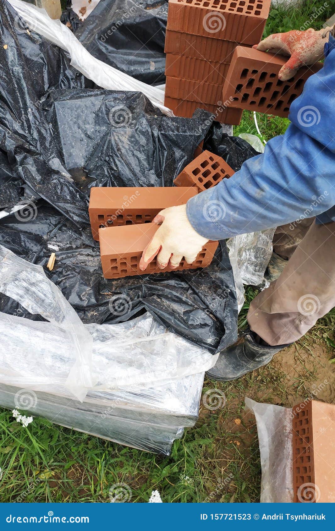 The Worker Translates the Facade Bricks for Further Measurement and ...