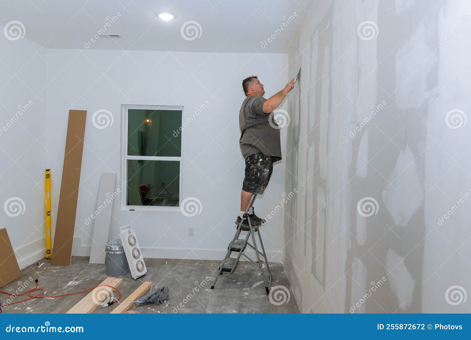 Worker Trowels Putty on Drywall Finishing Putty with Hand a Spatula ...