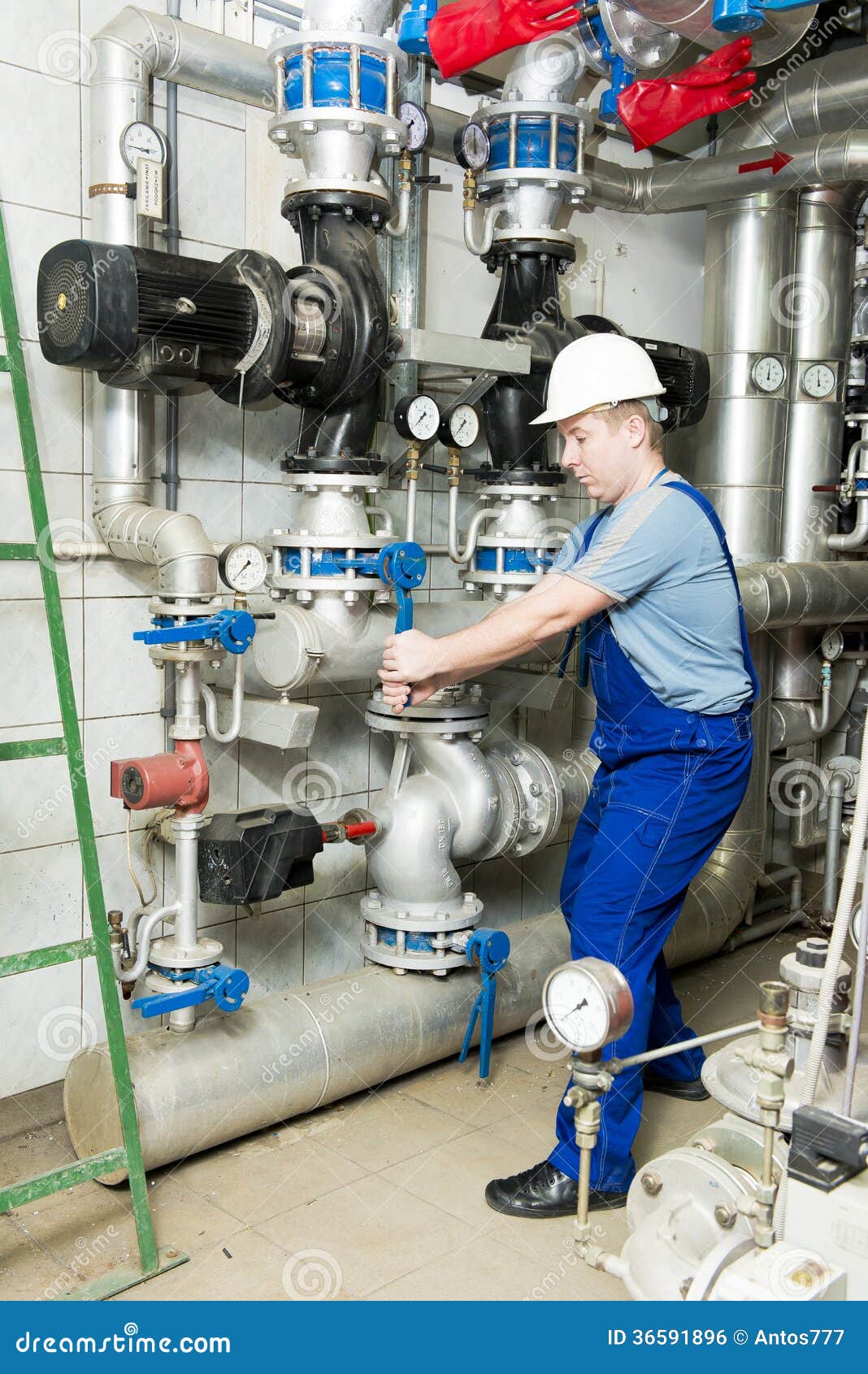 Worker turns a valve stock photo. Image of hard, fluid - 36591896