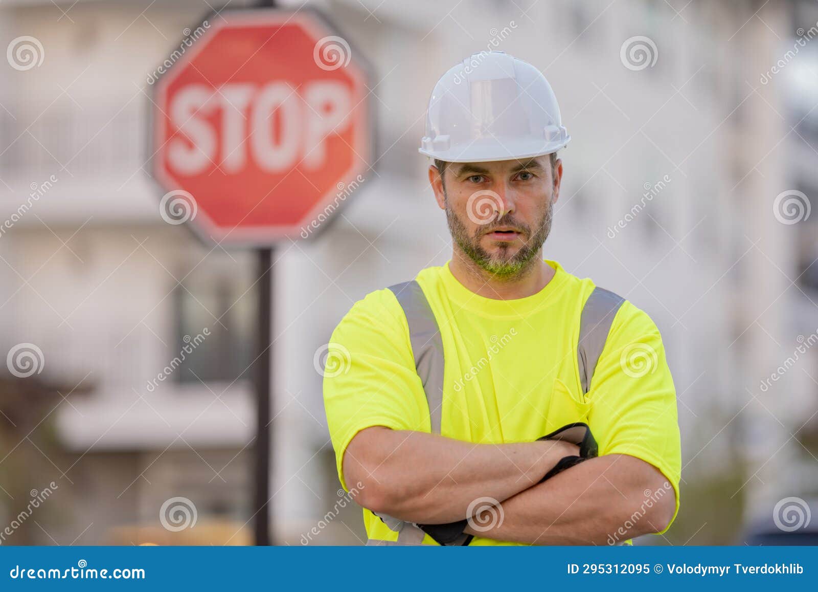 Worker in Uniform Gesturing Stop. Serious Engineer with Stop Road Sign ...