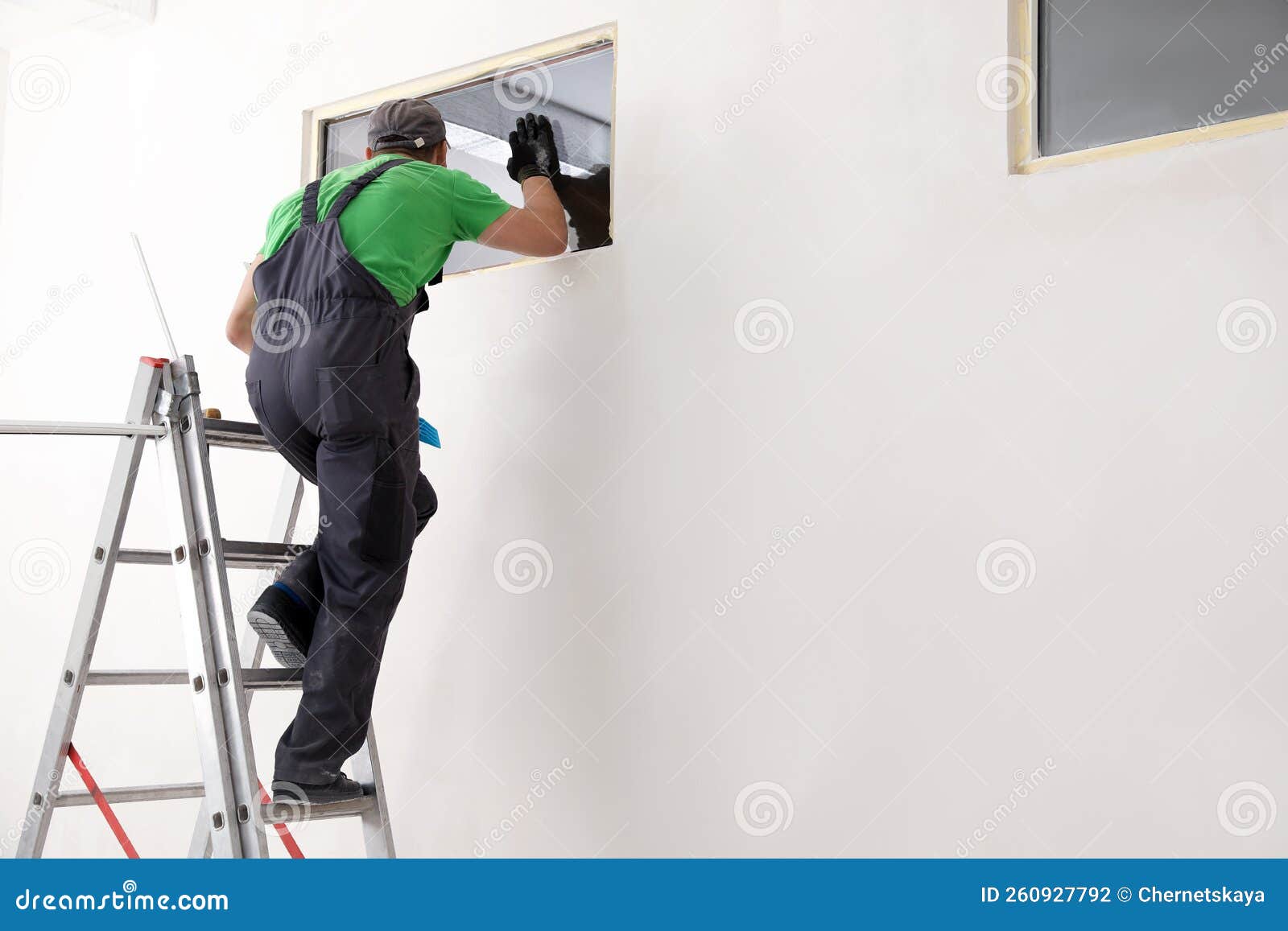 Worker in Uniform Installing Double Glazing Window Indoors Stock Photo ...