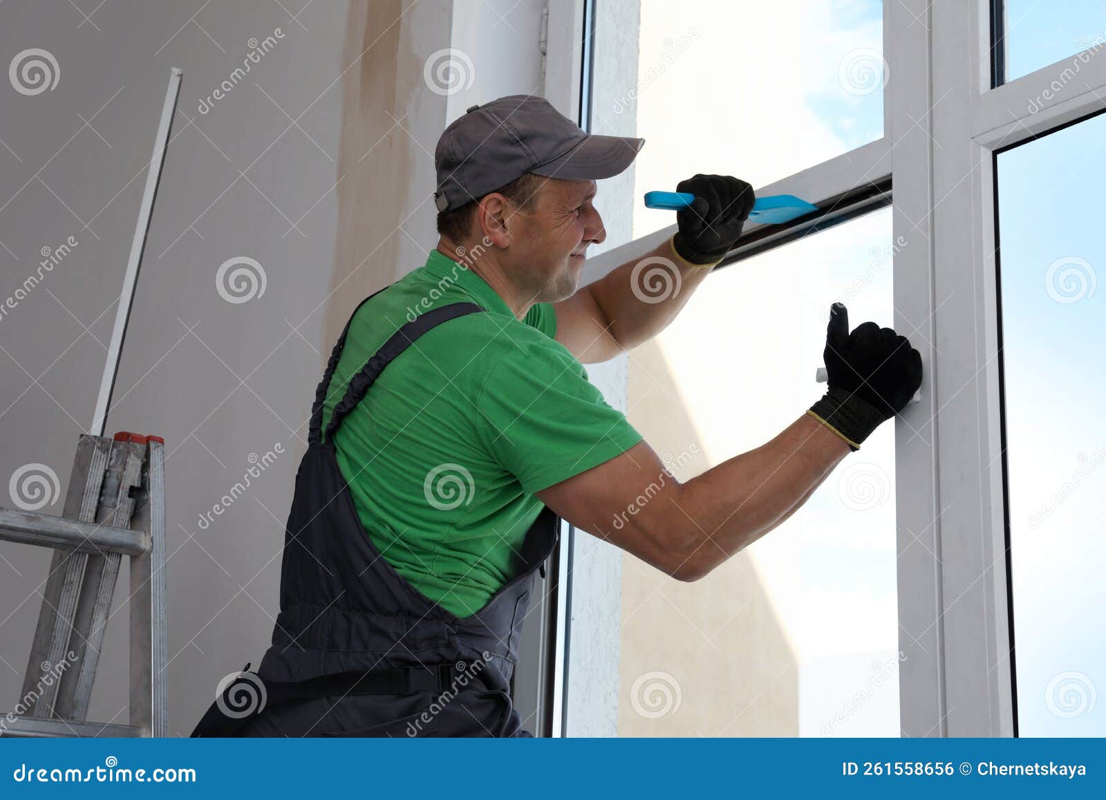Worker in Uniform Installing Double Glazing Window Indoors Stock Photo ...