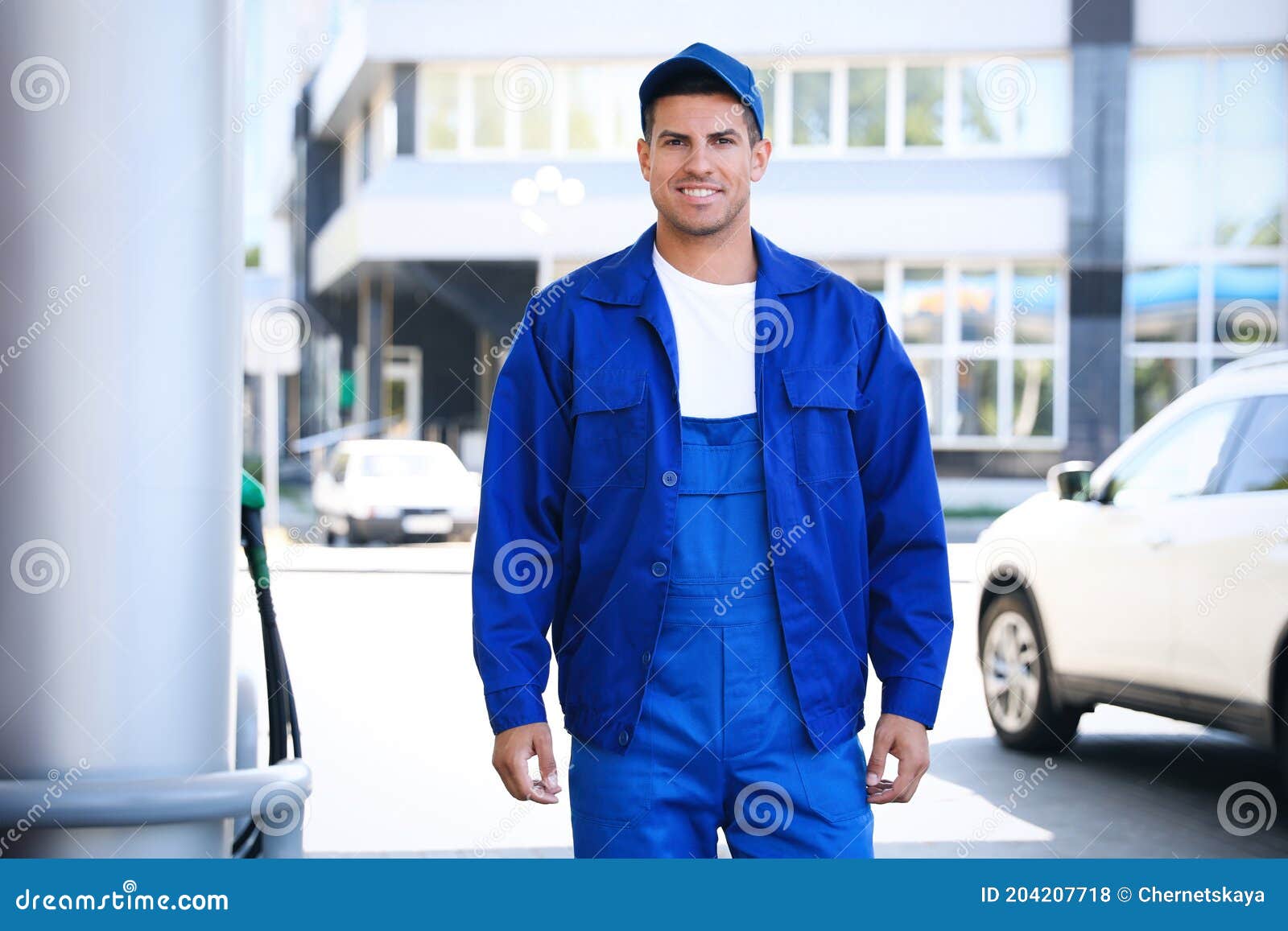 Worker in Uniform at Modern Gas Station Stock Photo - Image of drive ...