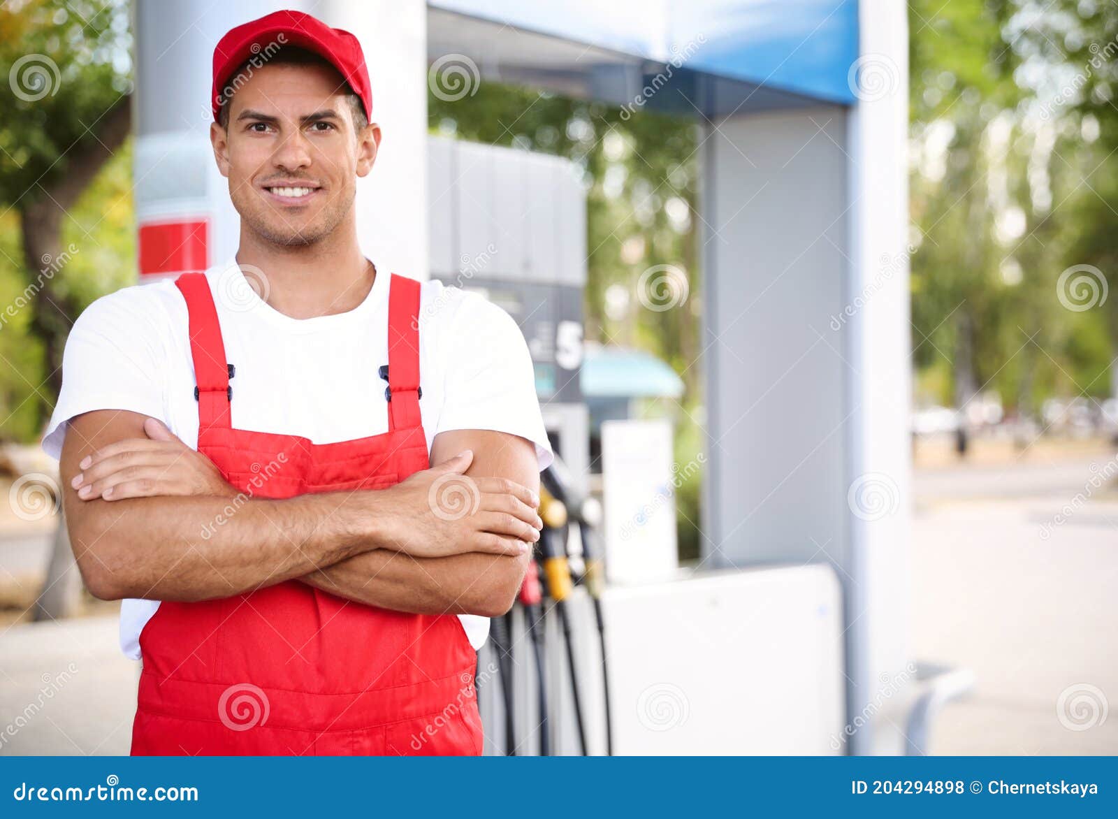 Worker in Uniform at Modern Gas Station Stock Photo - Image of ...