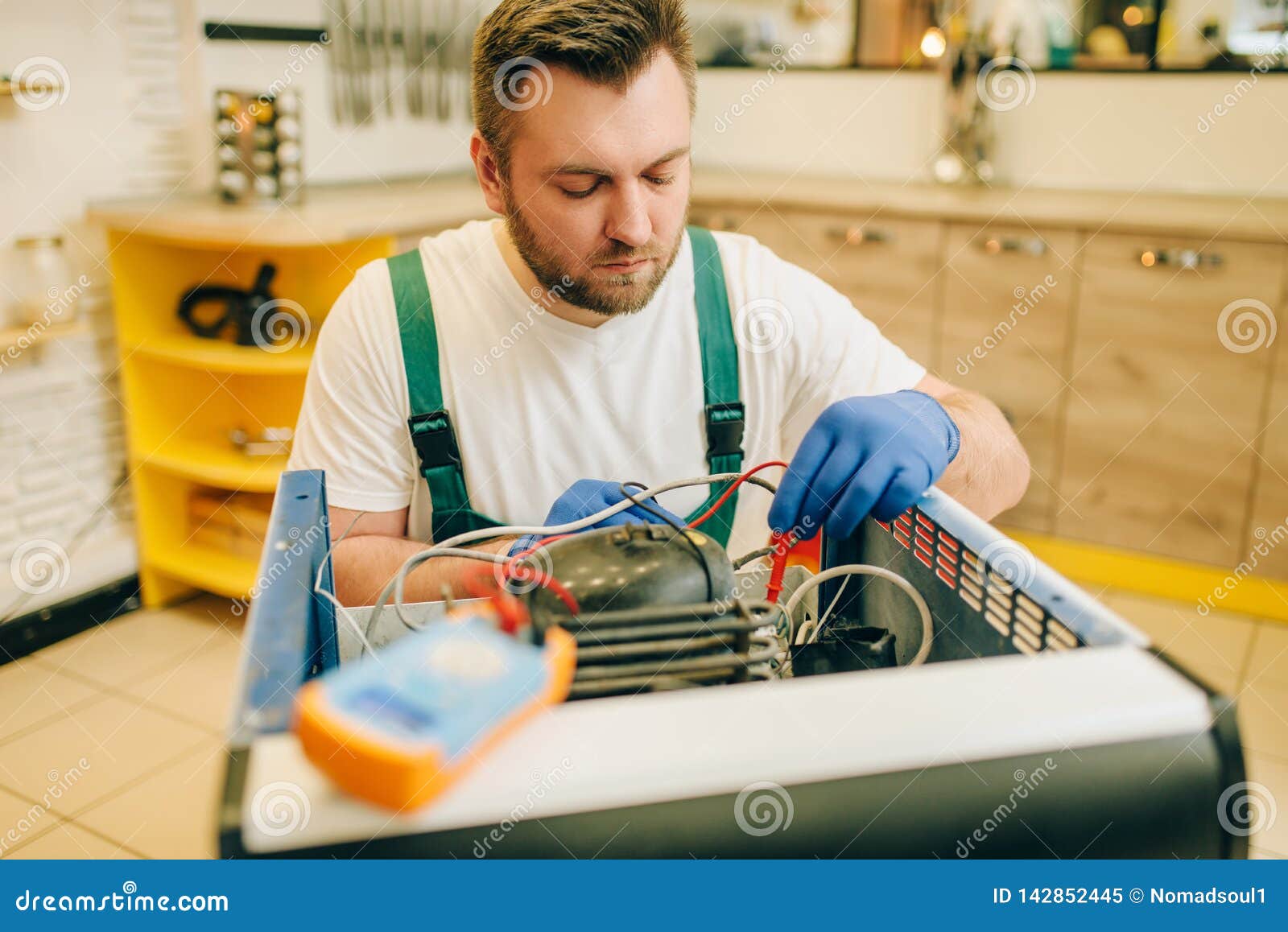 Worker in Uniform Testing Refrigerator at Home Stock Image - Image of ...