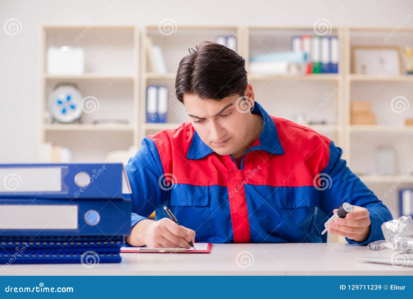 The Worker in Uniform Working on Project Stock Image - Image of ...