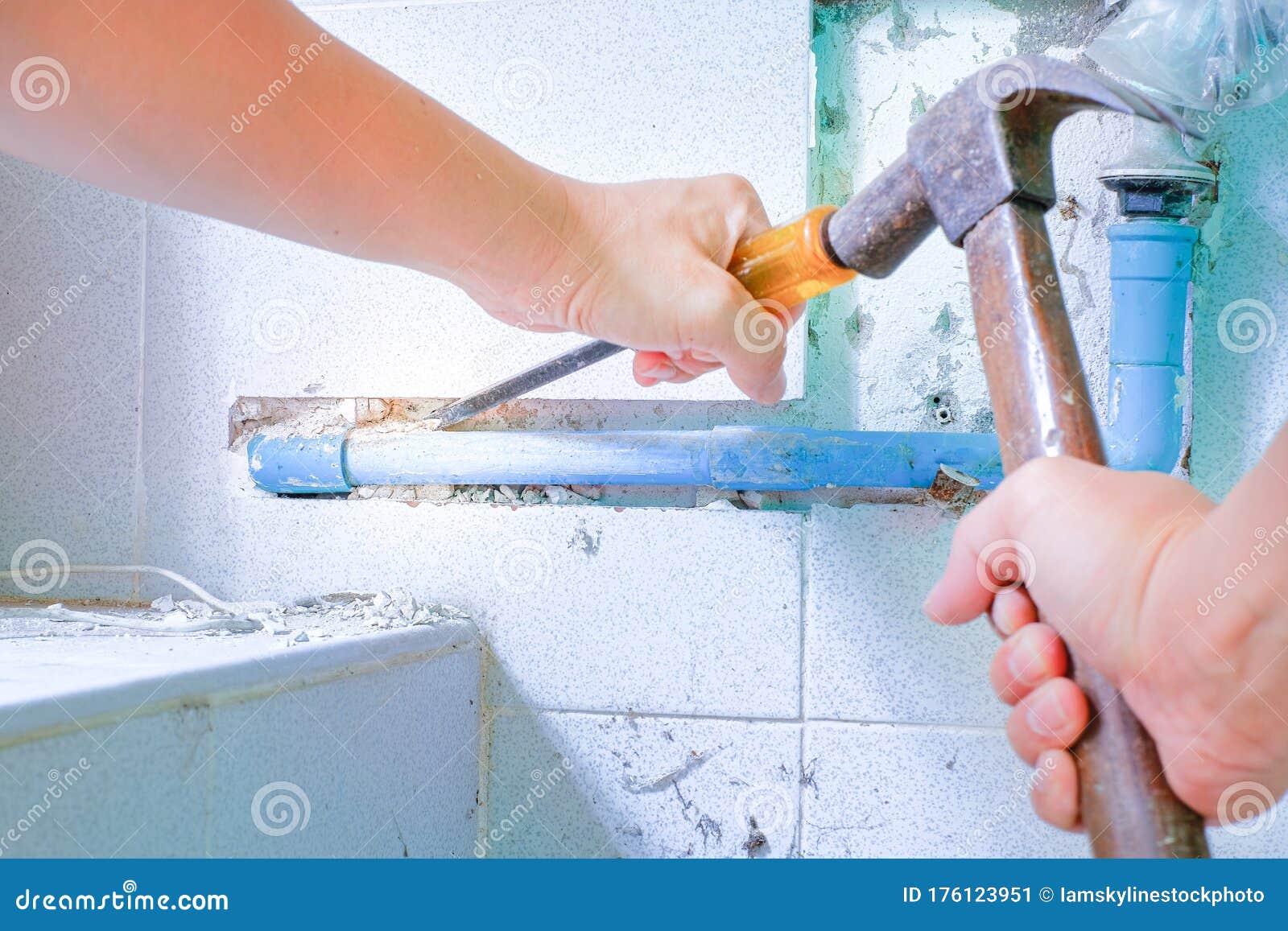 Worker Use Chisel To Remove the Tile and Pipe from the Wall Stock Image ...
