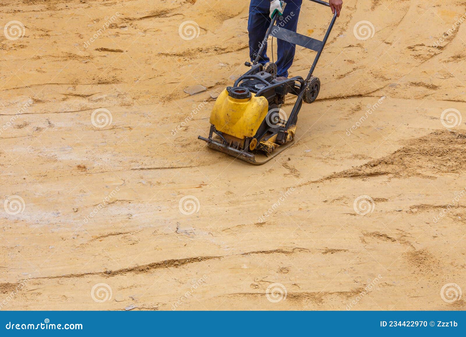 Worker in Use Vibratory Plate Compactor for Compaction Sand during Path ...