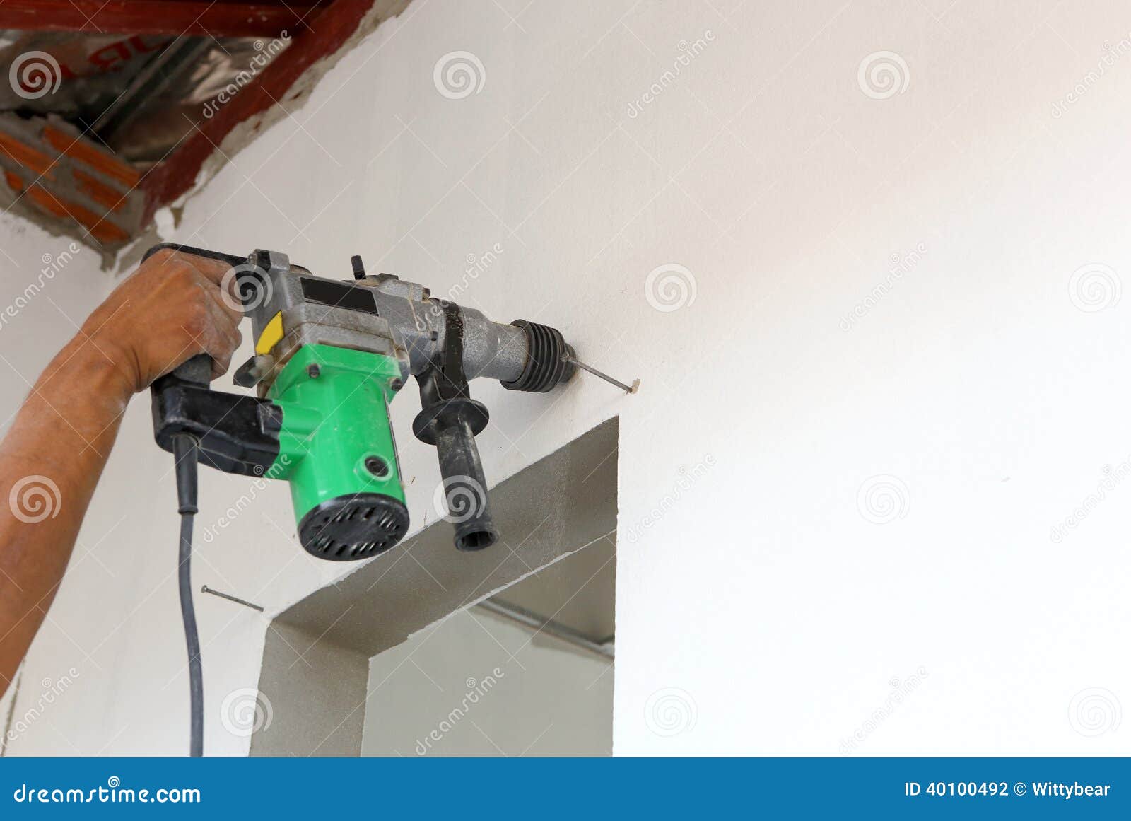 Worker Use Driller for Drill Wall Stock Photo - Image of safety, young ...