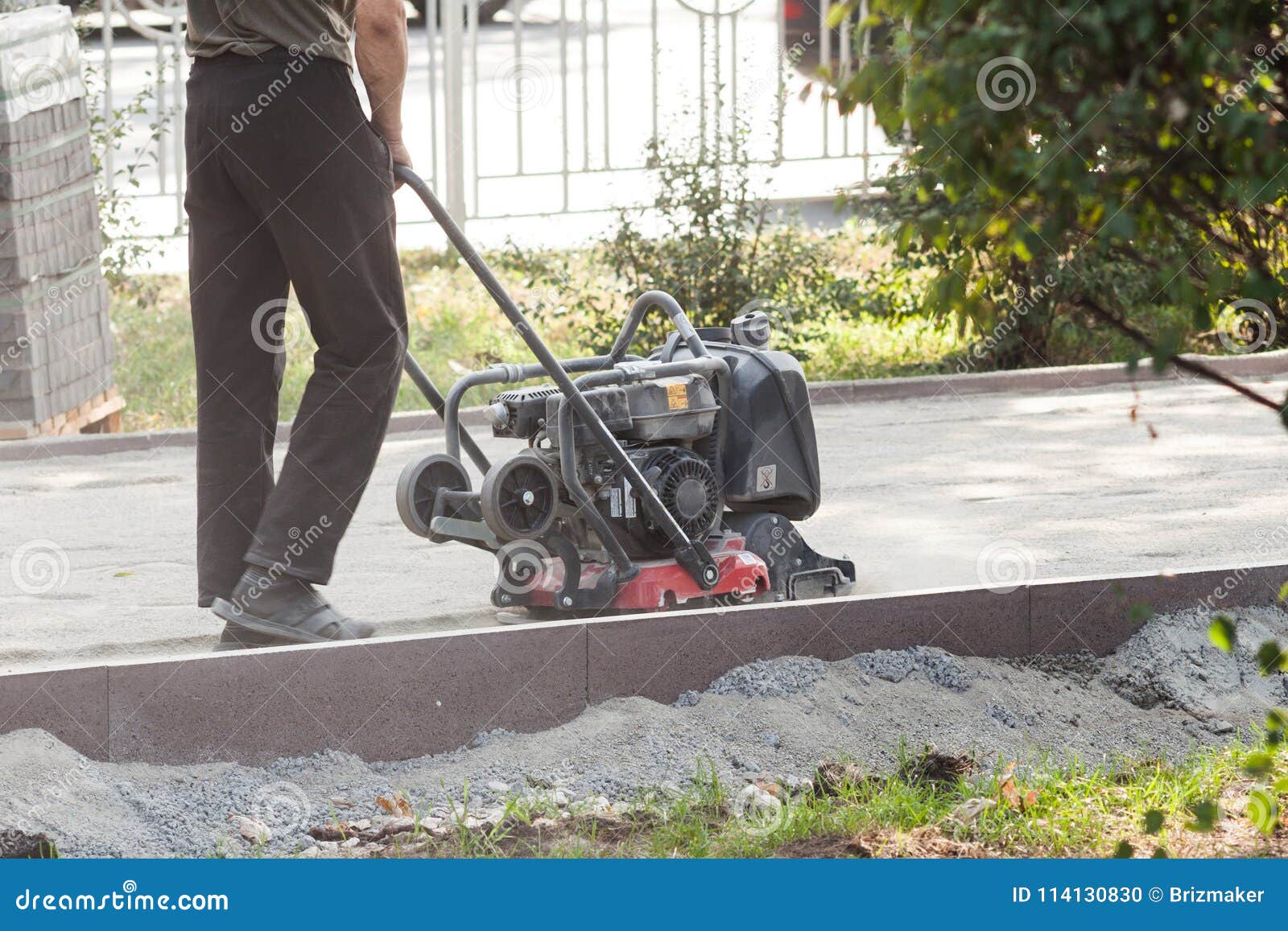 Worker Use Vibratory Plate Compactor Compacting Ground at Road Repair ...