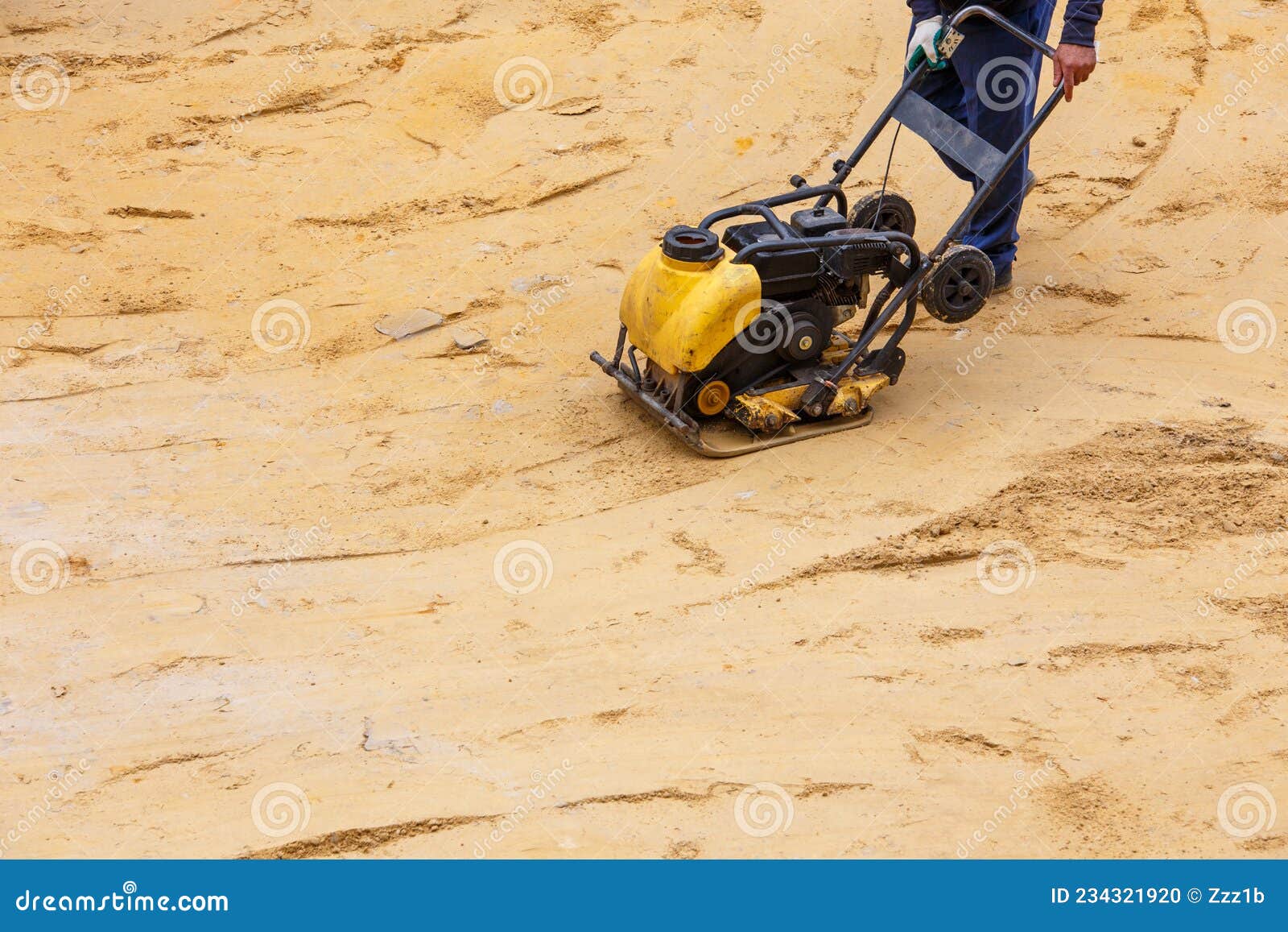 Worker in Use Vibratory Plate Compactor for Compaction Sand during Path ...