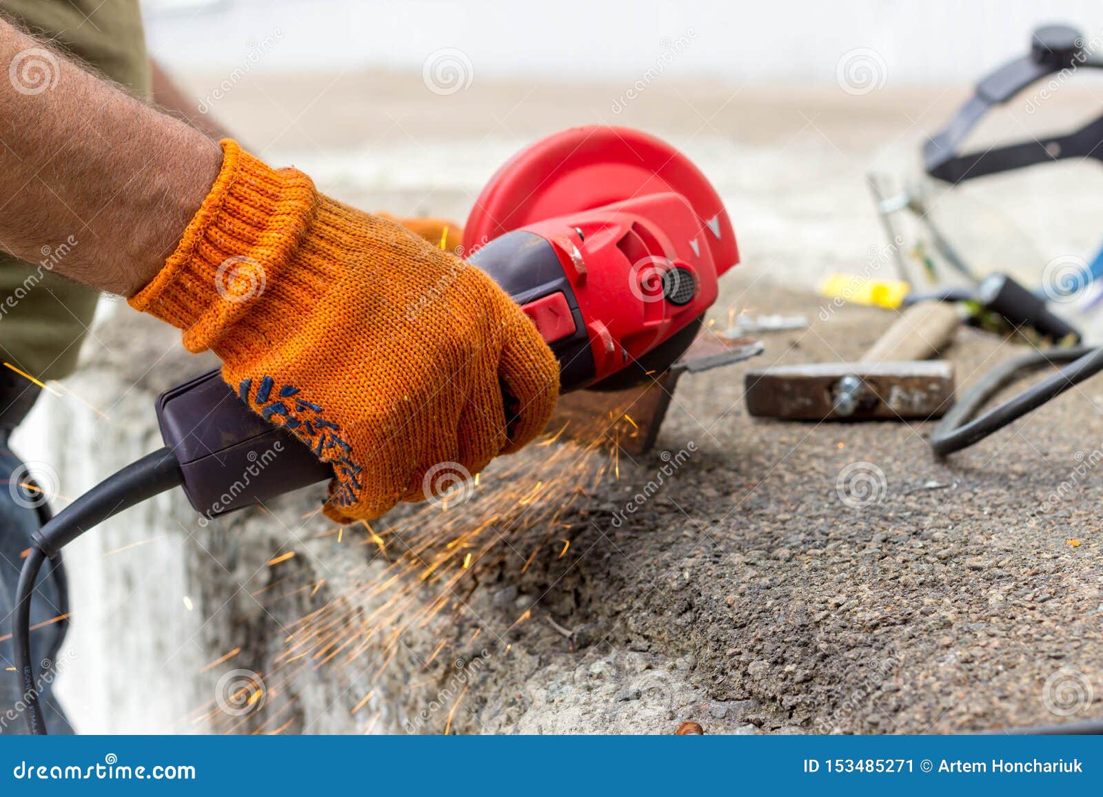 The Worker Uses an Angle Drive Grinder To Work with a Metal Corner ...