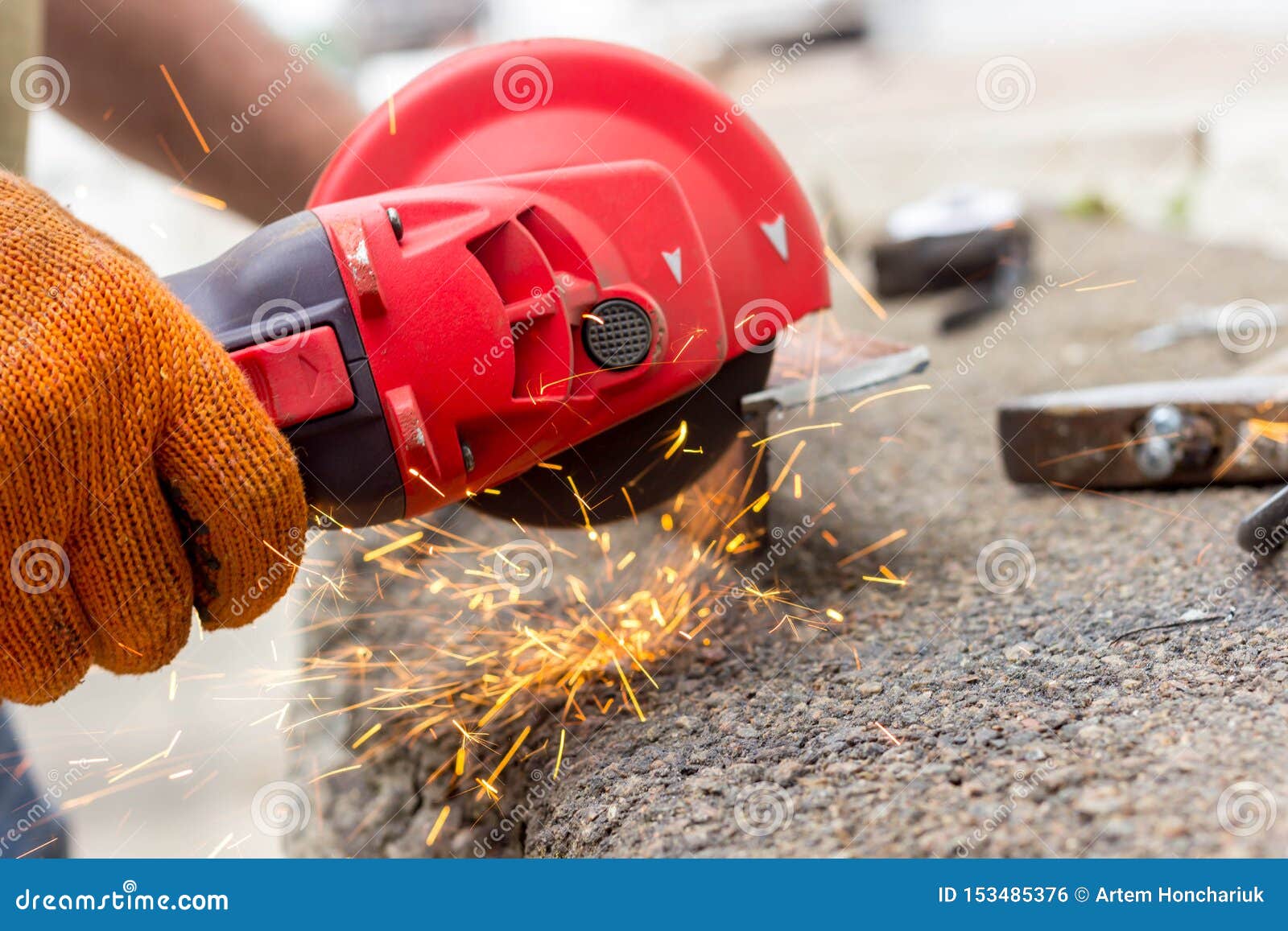 The Worker Uses an Angle Drive Grinder To Work with a Metal Corner ...