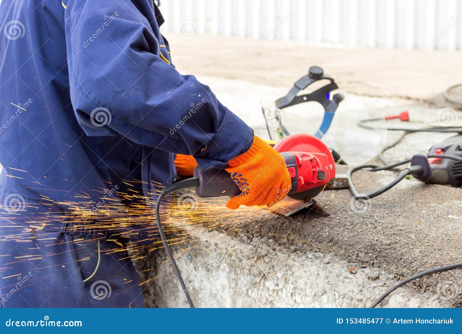 The Worker Uses an Angle Drive Grinder To Work with a Metal Corner ...