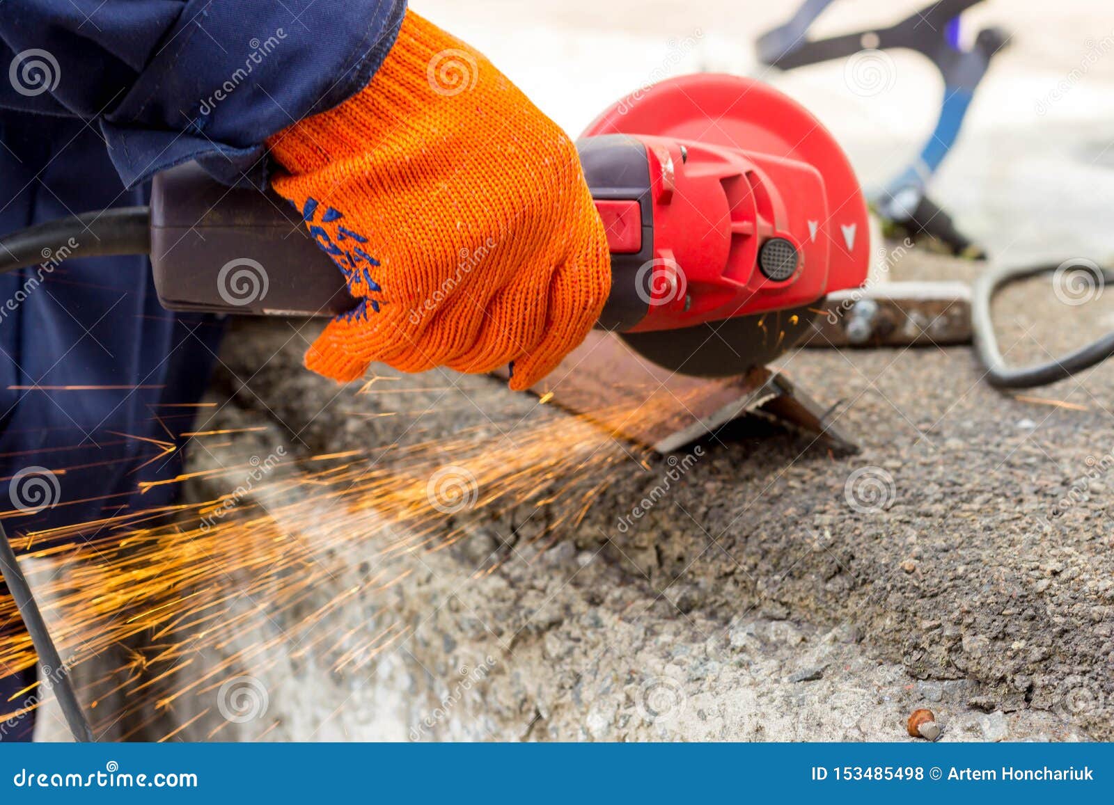 The Worker Uses an Angle Drive Grinder To Work with a Metal Corner ...