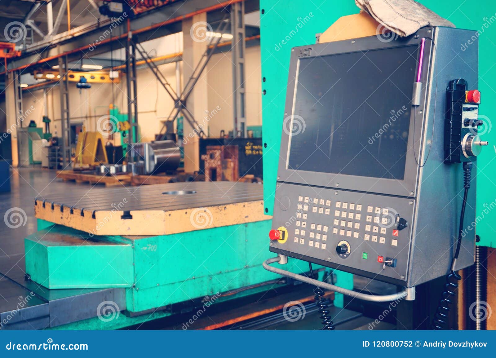 The Worker Uses the Control Panel of the CNC Machine To Process the ...