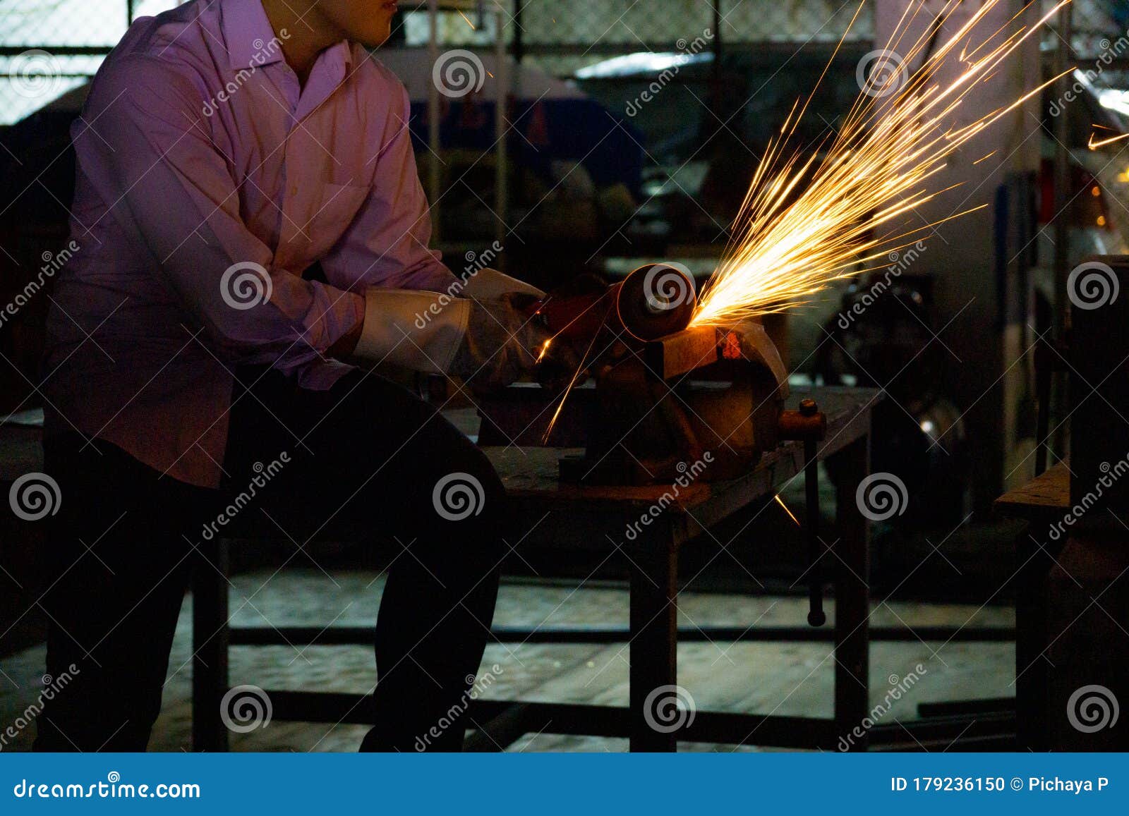 The Worker Uses Cutting Machine To Cut Metal, Focus on Flash Light Line ...