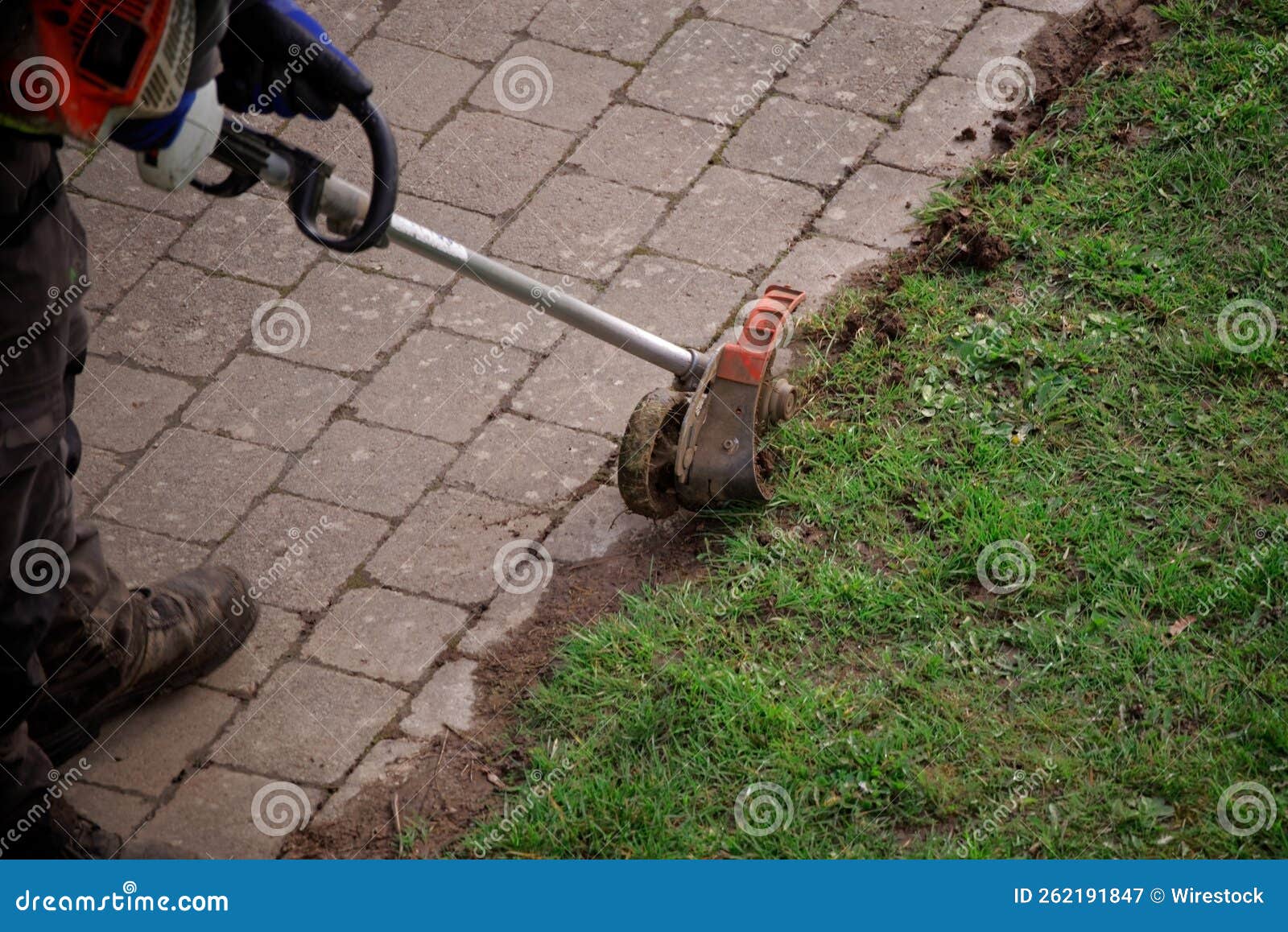 Worker Uses Edge Trimmer at the Pathway Stock Image - Image of string ...