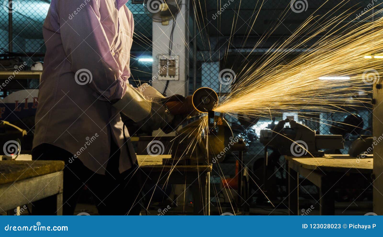 Worker Uses Grinding Cut Metal, Focus on Flash Light Line of Sharp ...
