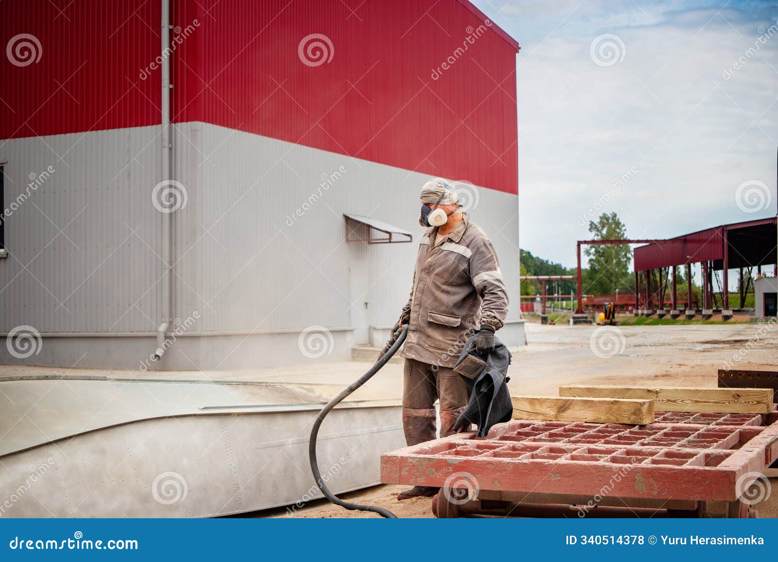 Worker Sandblasting a Large Metal Structure To Remove Rust at an ...