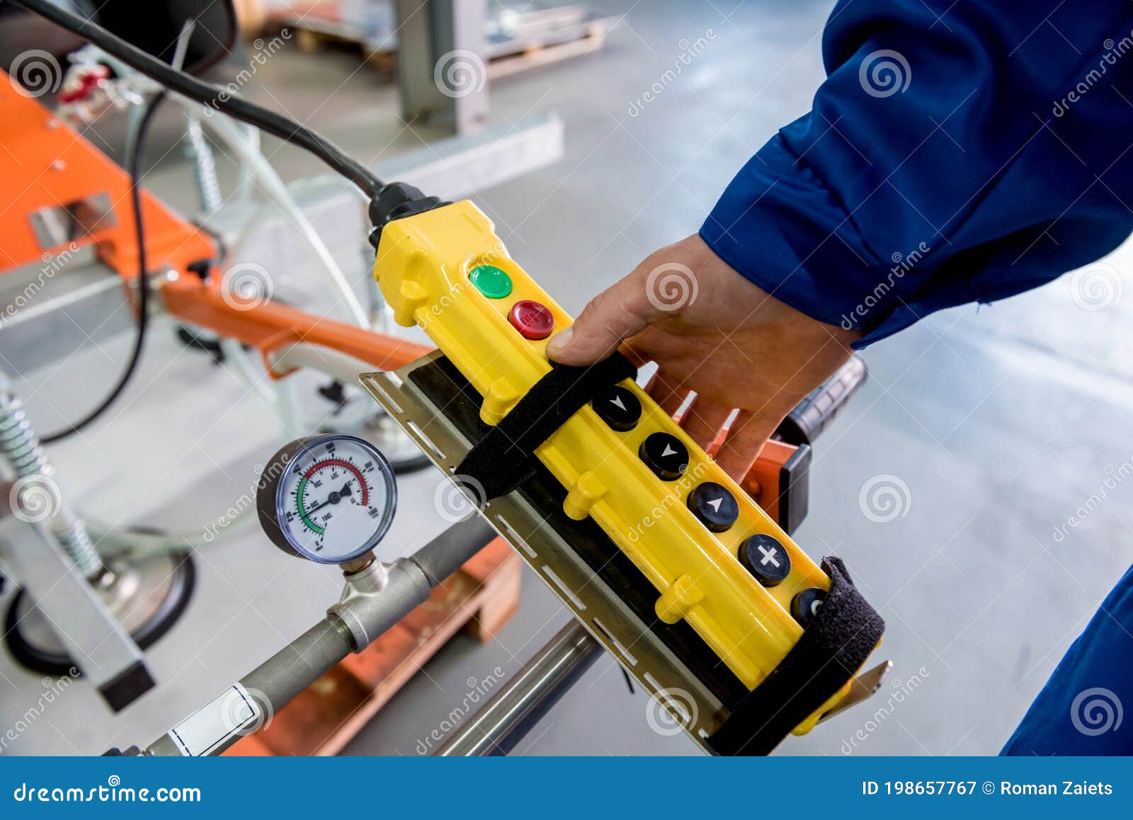 Worker Uses Suction Cups for Transporting Large Sheets of Metal Stock ...