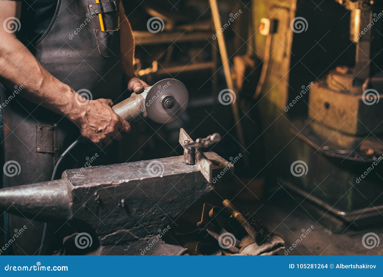Man Using Angle Grinder in Factory and Throwing Sparks Stock Photo ...