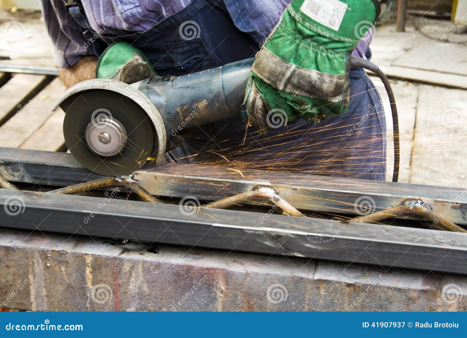 Worker using angle grinder stock image. Image of industry - 41907937