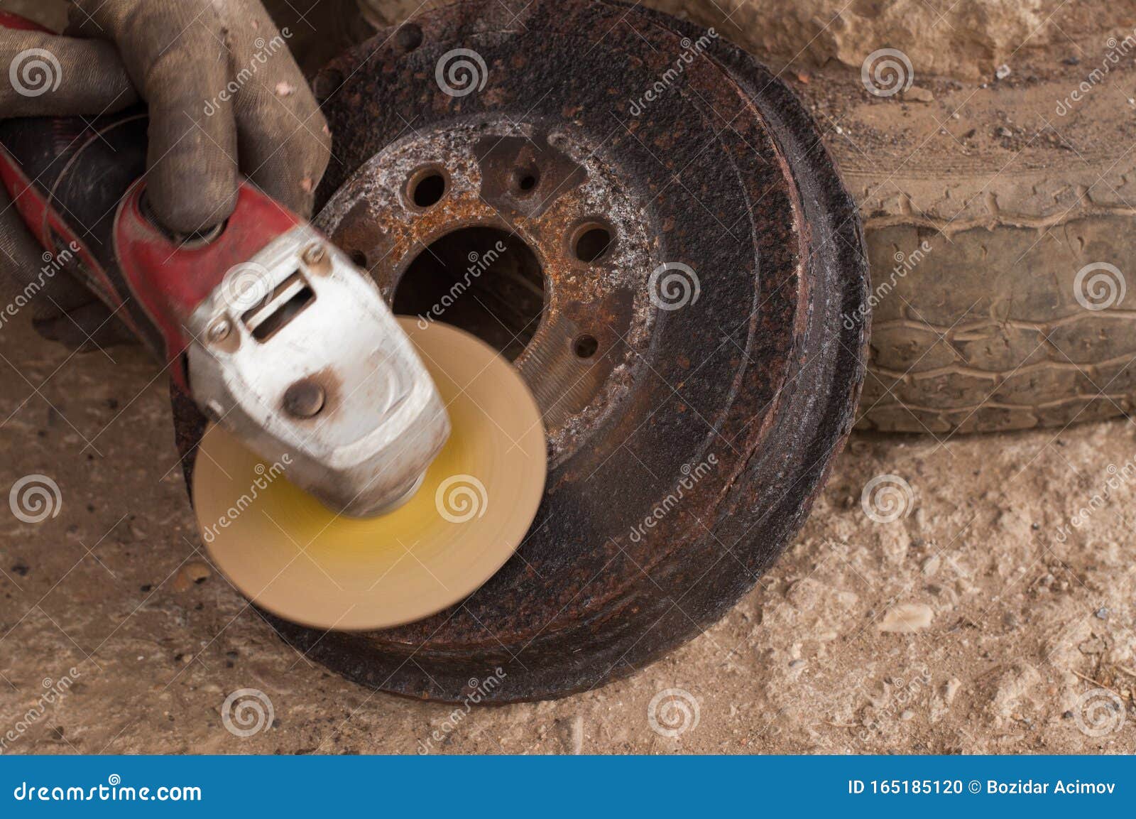 Worker Using Angle Grinder in Workshop.Car Disk Processing Stock Photo ...