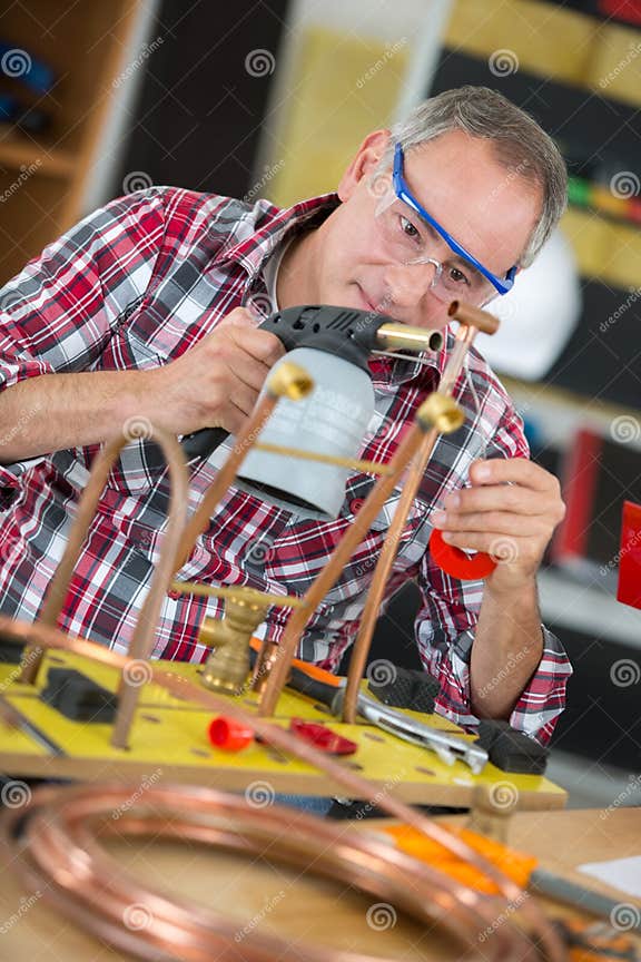 Worker using a blowtorch stock image. Image of blowlamp - 116226345