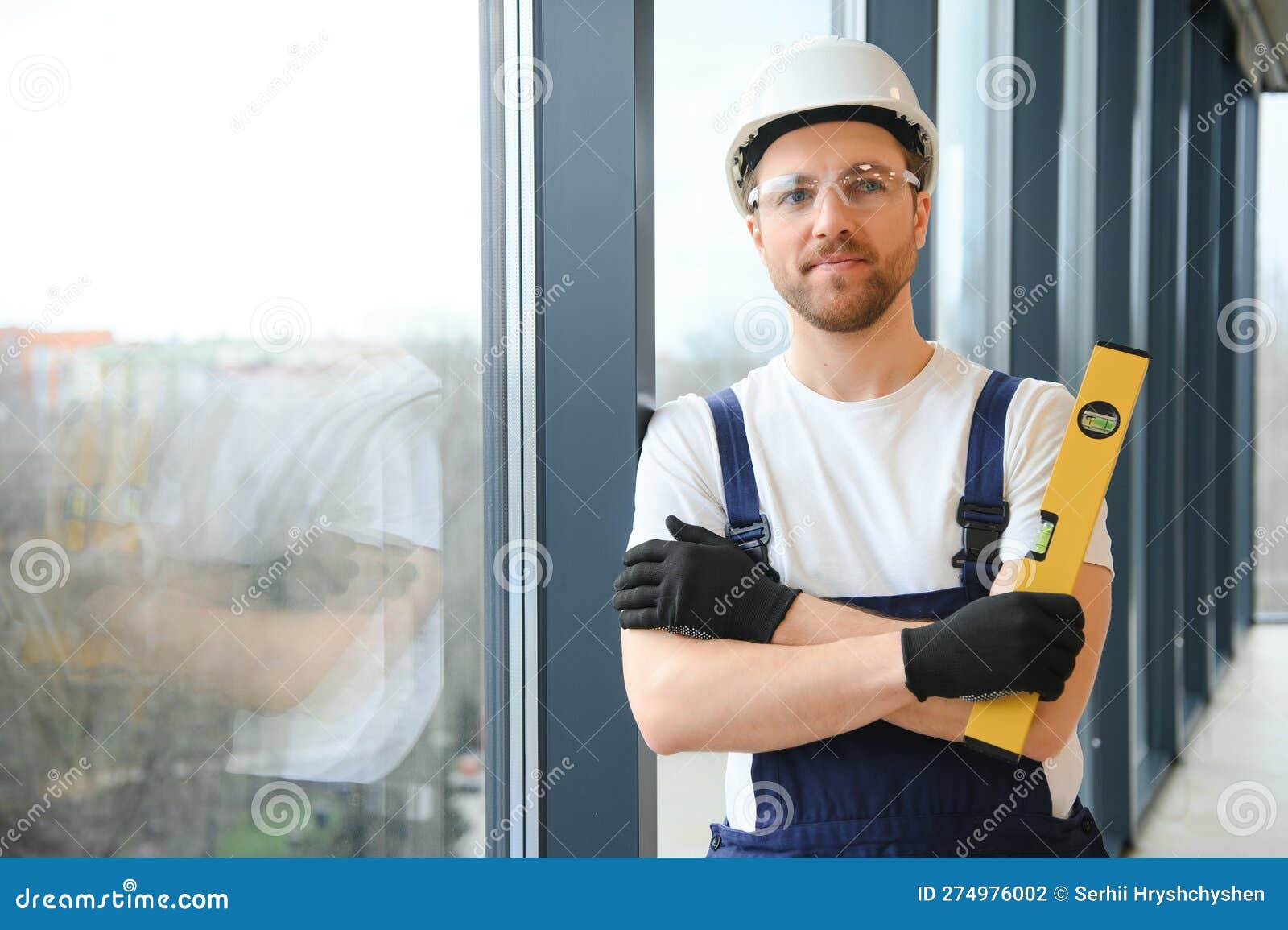 Worker Using Bubble Level after Plastic Window Installation Indoors ...