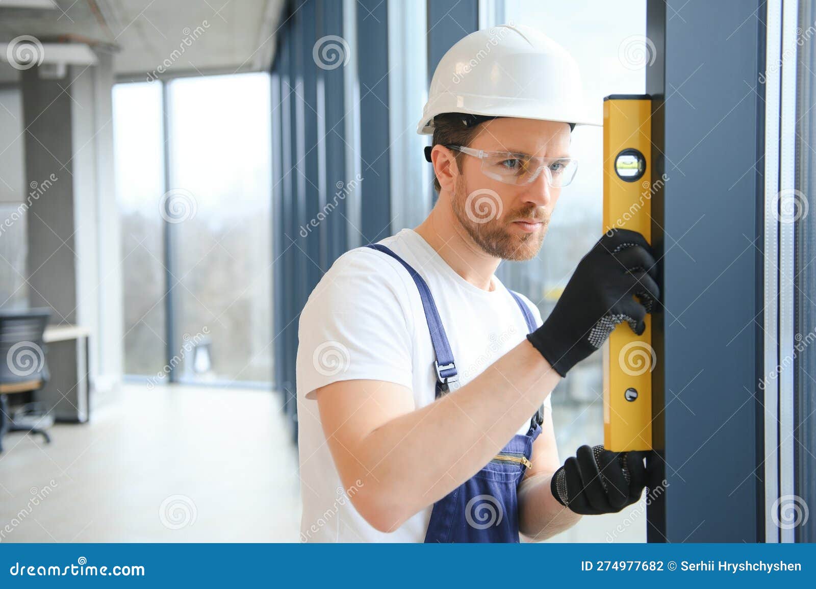 Worker Using Bubble Level after Plastic Window Installation Indoors ...